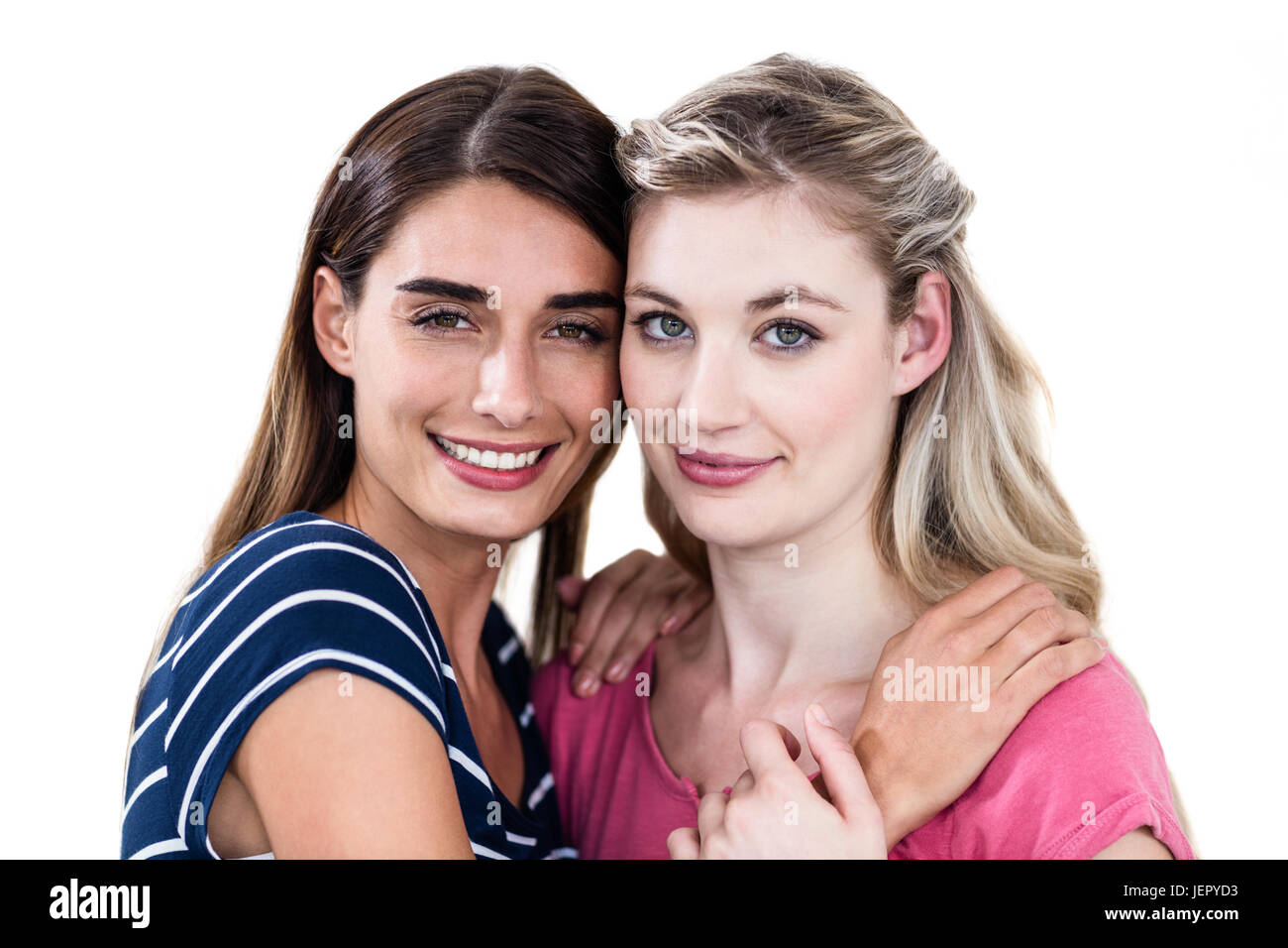 Portrait of smiling female friends hugging Stock Photo - Alamy