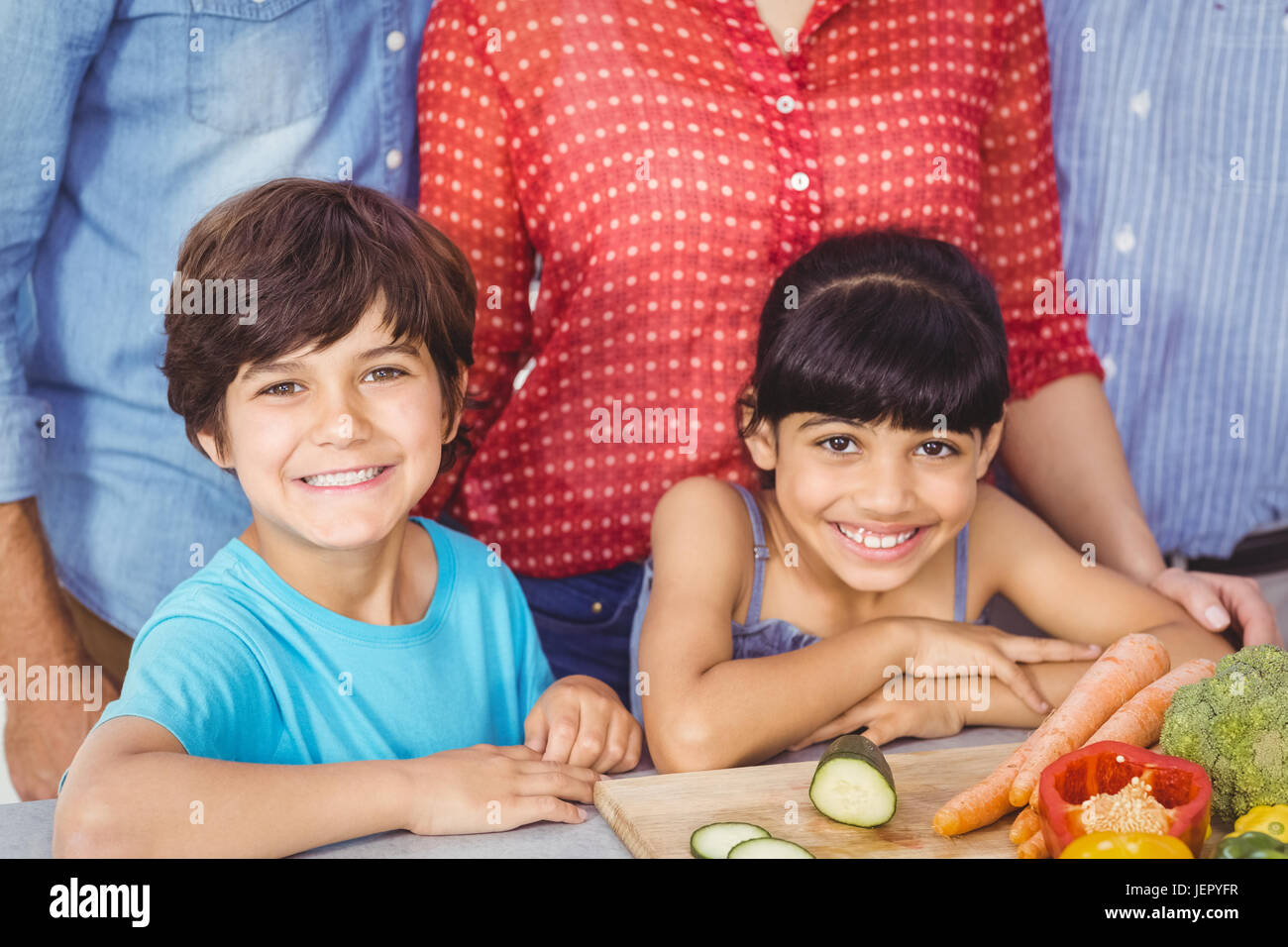 Portrait of siblings with family Stock Photo - Alamy