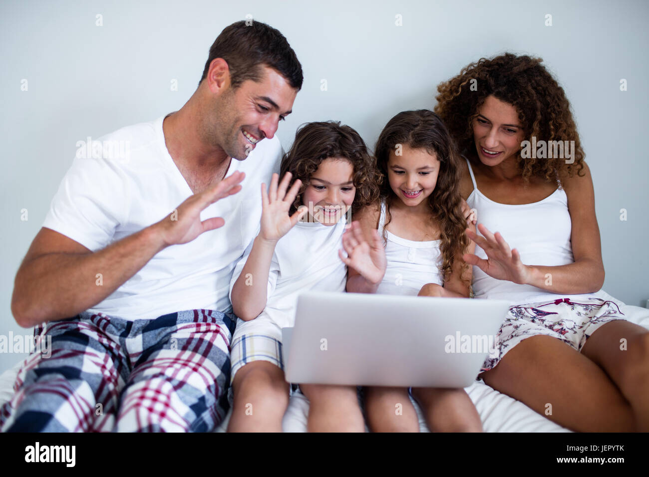 Mother daughter video chatting laptop hi-res stock photography and ...