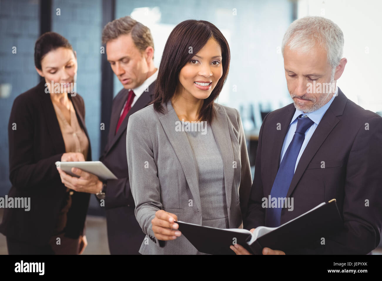 Team of business people interacting Stock Photo - Alamy