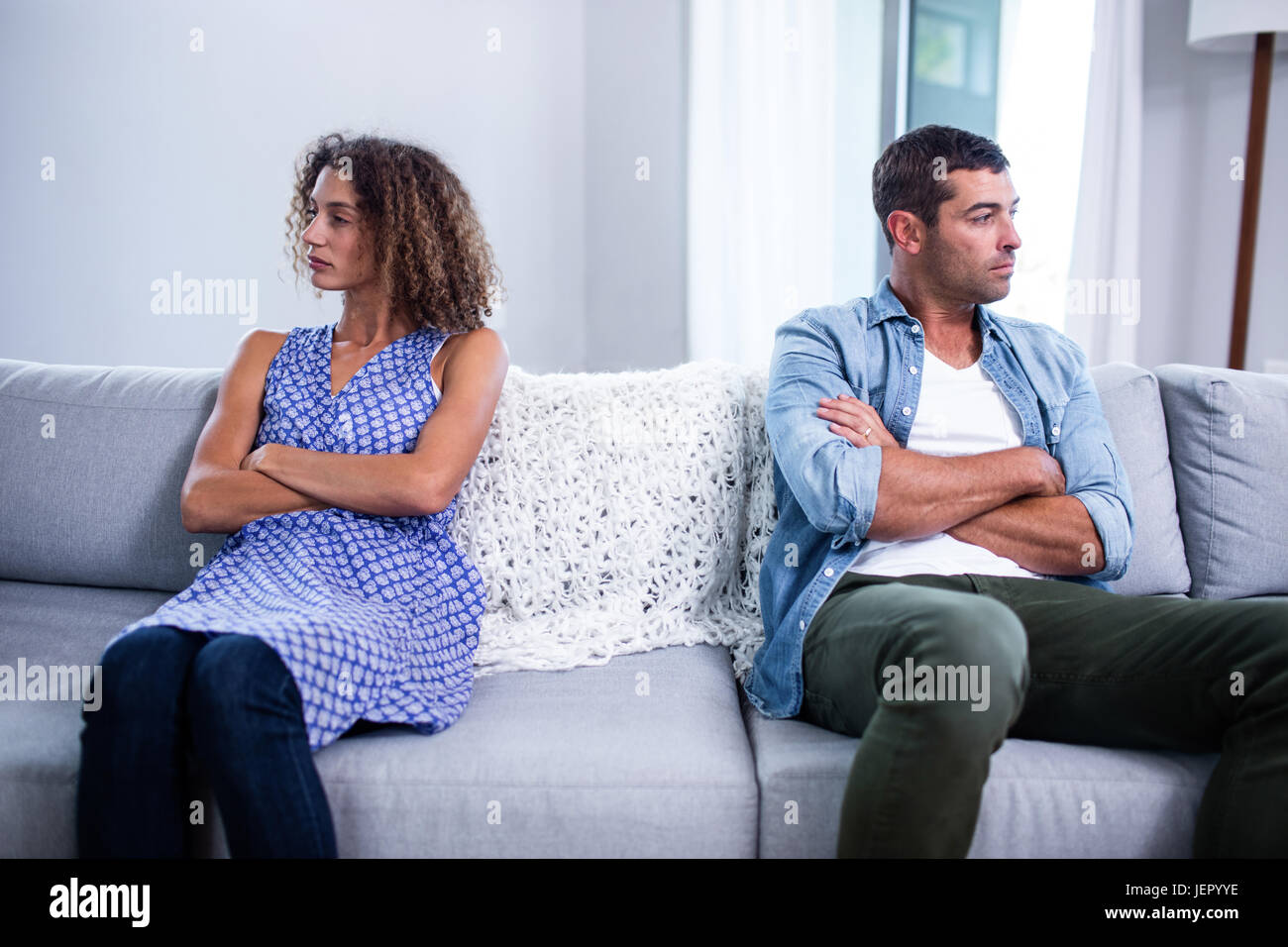 Upset young couple ignoring each other Stock Photo - Alamy