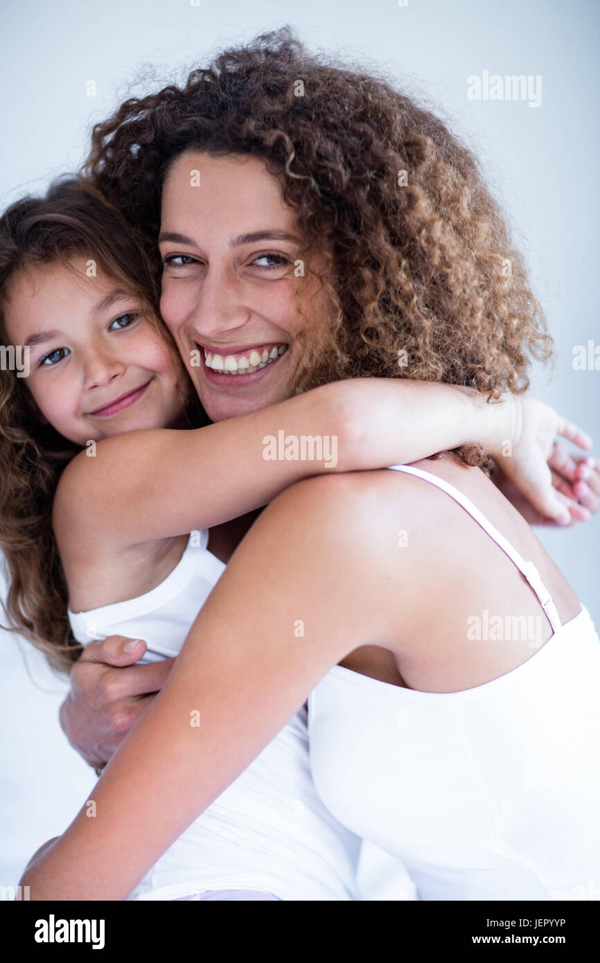 Portrait of mother and daughter embracing Stock Photo - Alamy