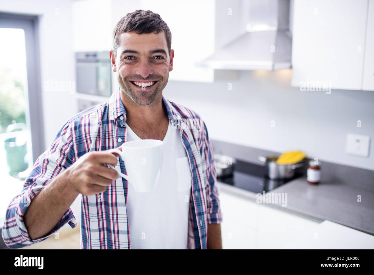Portrait of happy man having coffee Stock Photo - Alamy