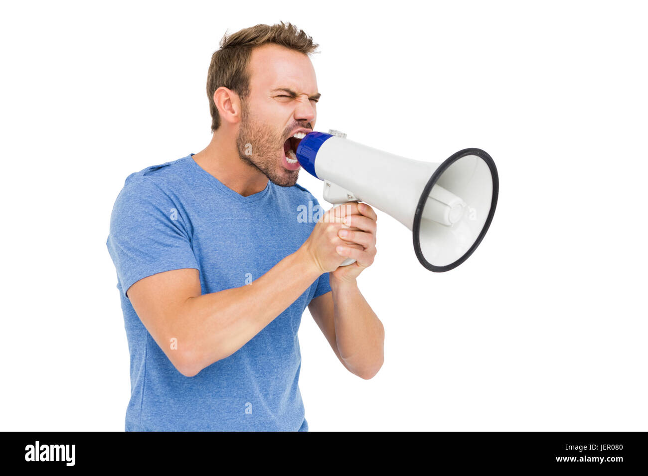 Young man shouting on horn loudspeaker Stock Photo - Alamy