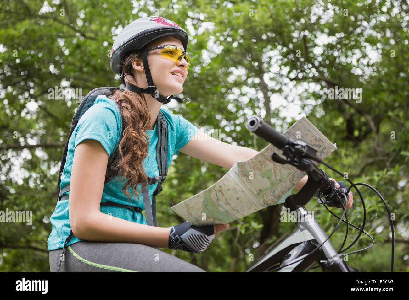 Woman checking the map Stock Photo - Alamy