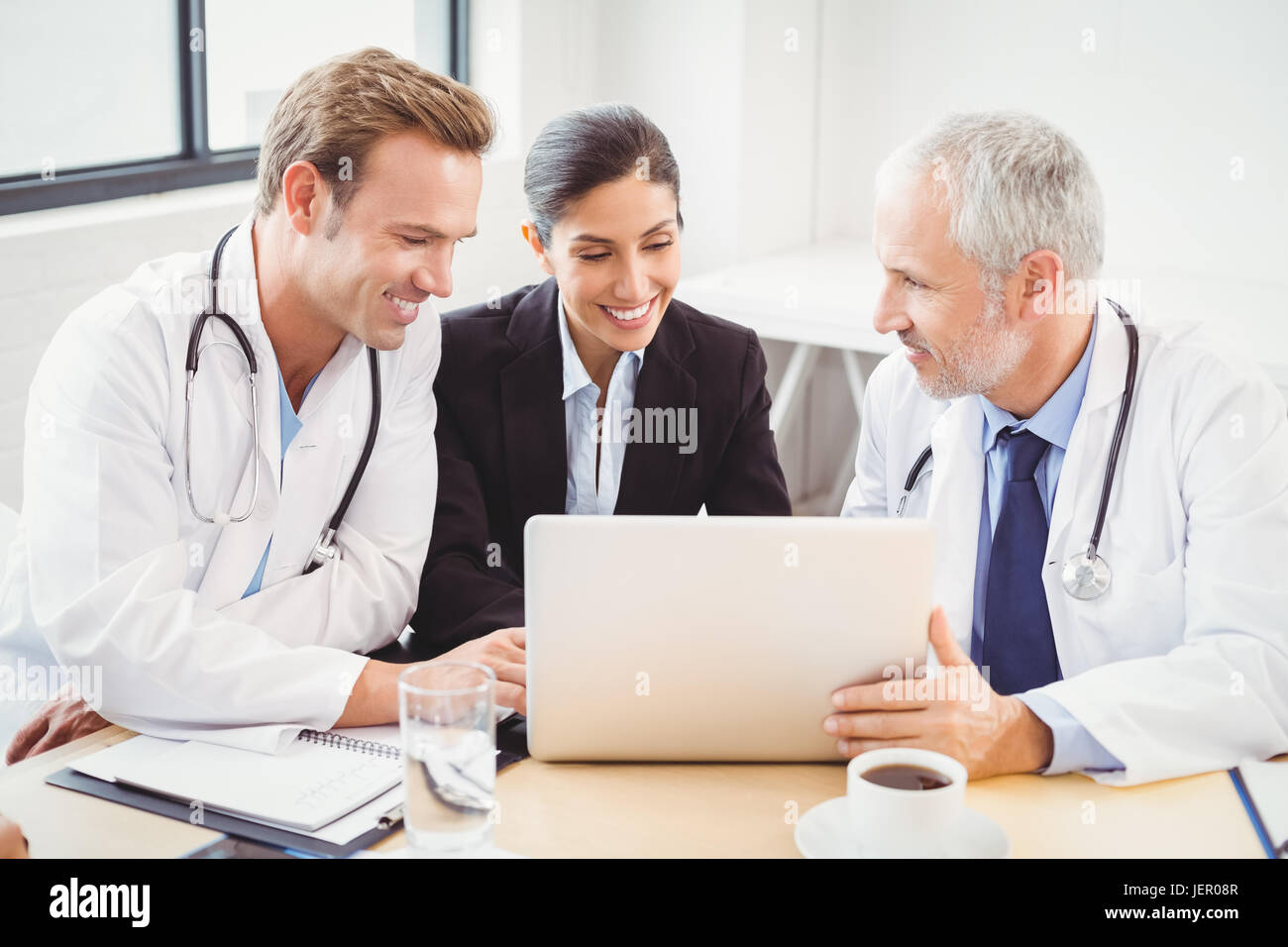 Medical team using laptop in conference room Stock Photo - Alamy