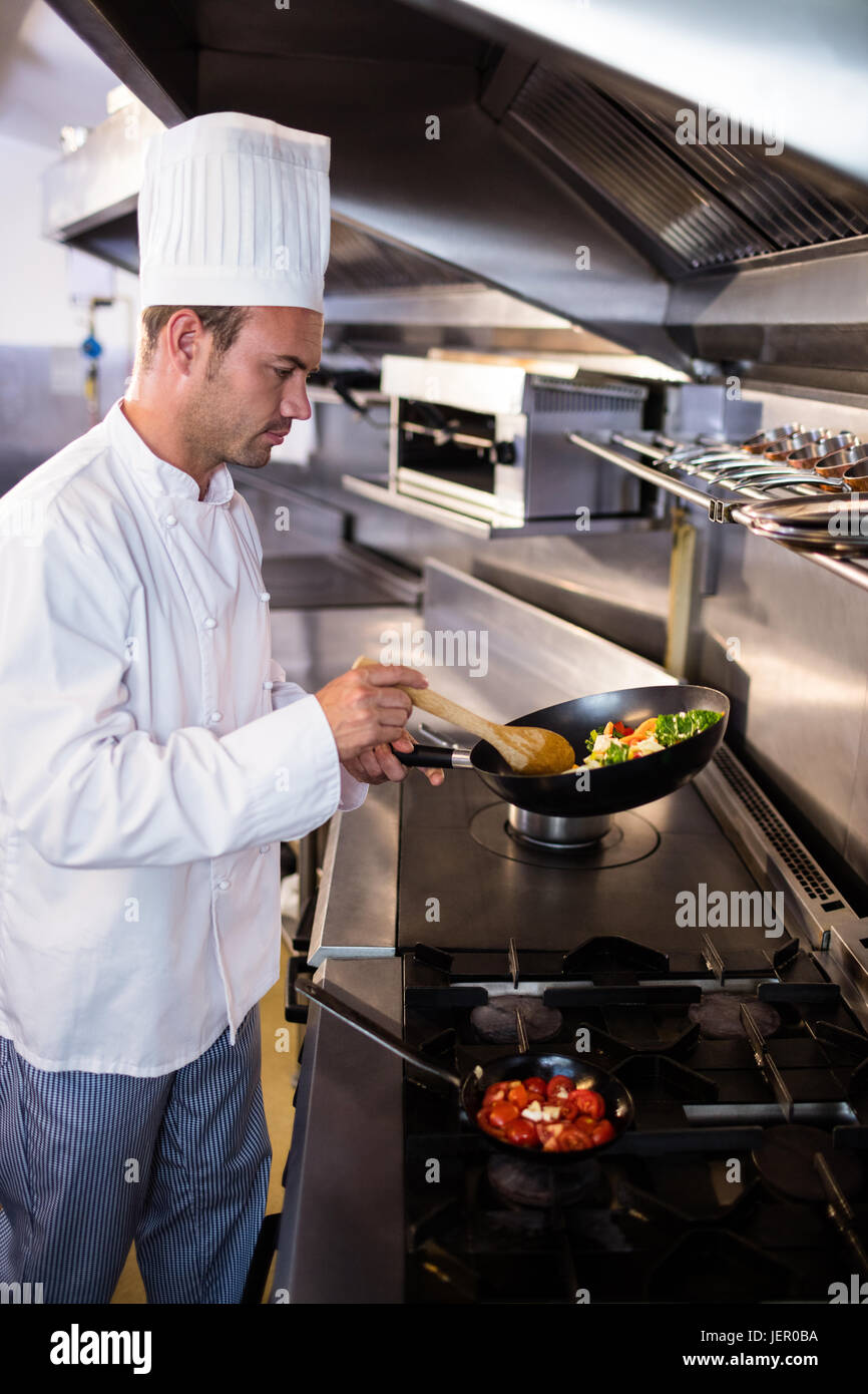 Chef preparing food in the kitchen Stock Photo - Alamy