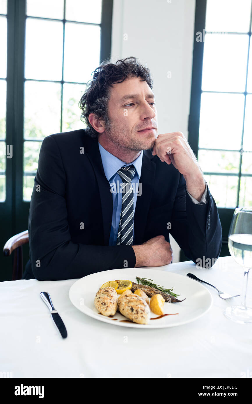 Sitting looking away contemplation wine glass food and drink hi-res ...