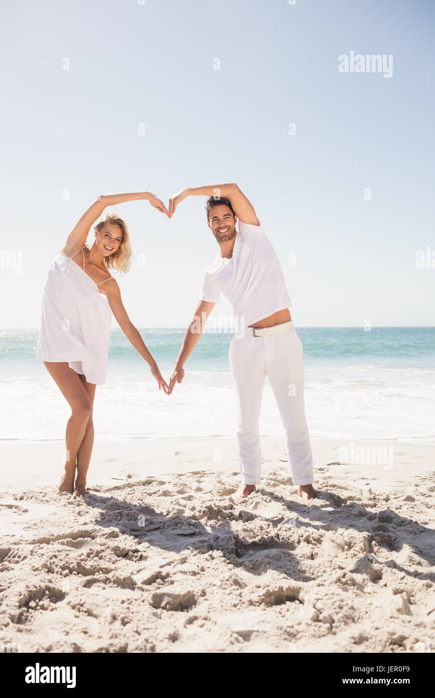 Couple making heart shape arms hi-res stock photography and images - Alamy