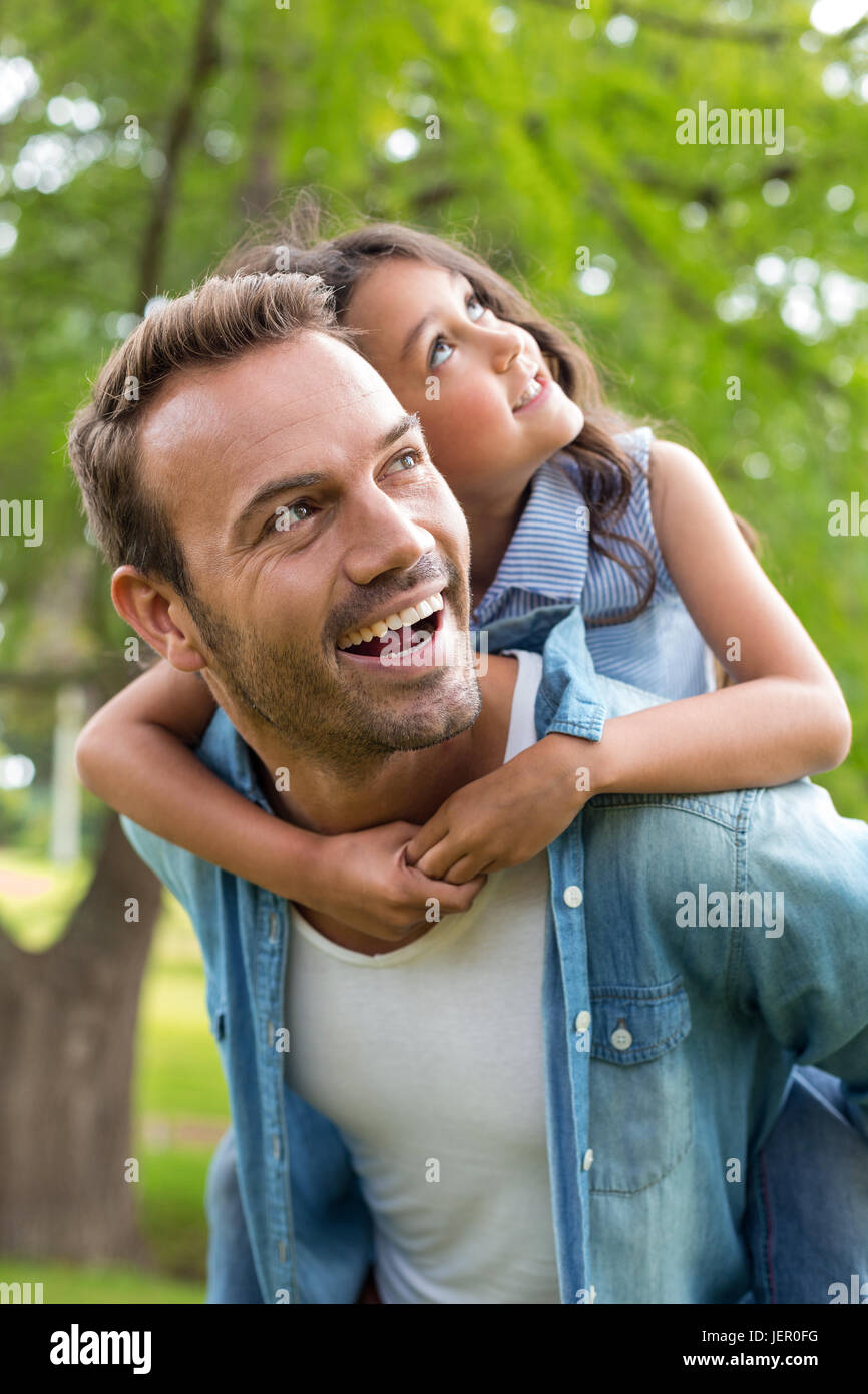 Father giving piggyback ride to daughter Stock Photo - Alamy