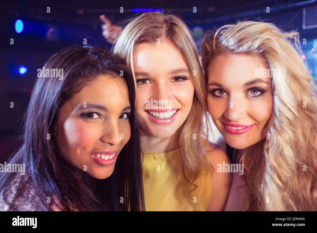 Happy friends posing together Stock Photo - Alamy