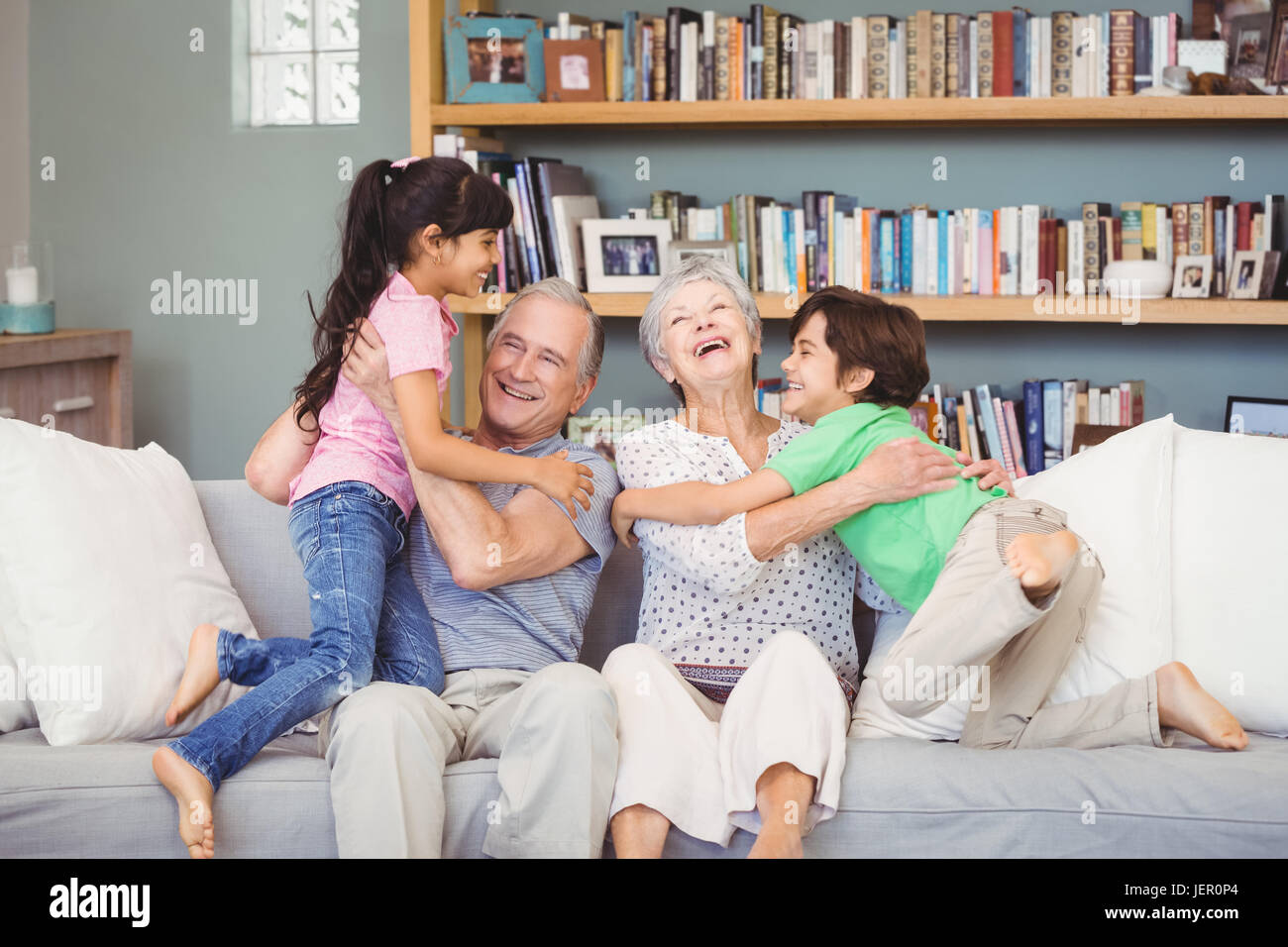 Grandchildren playing with grandparents Stock Photo - Alamy