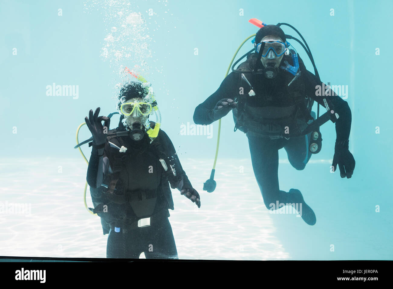 Couple practicing scuba diving together Stock Photo - Alamy