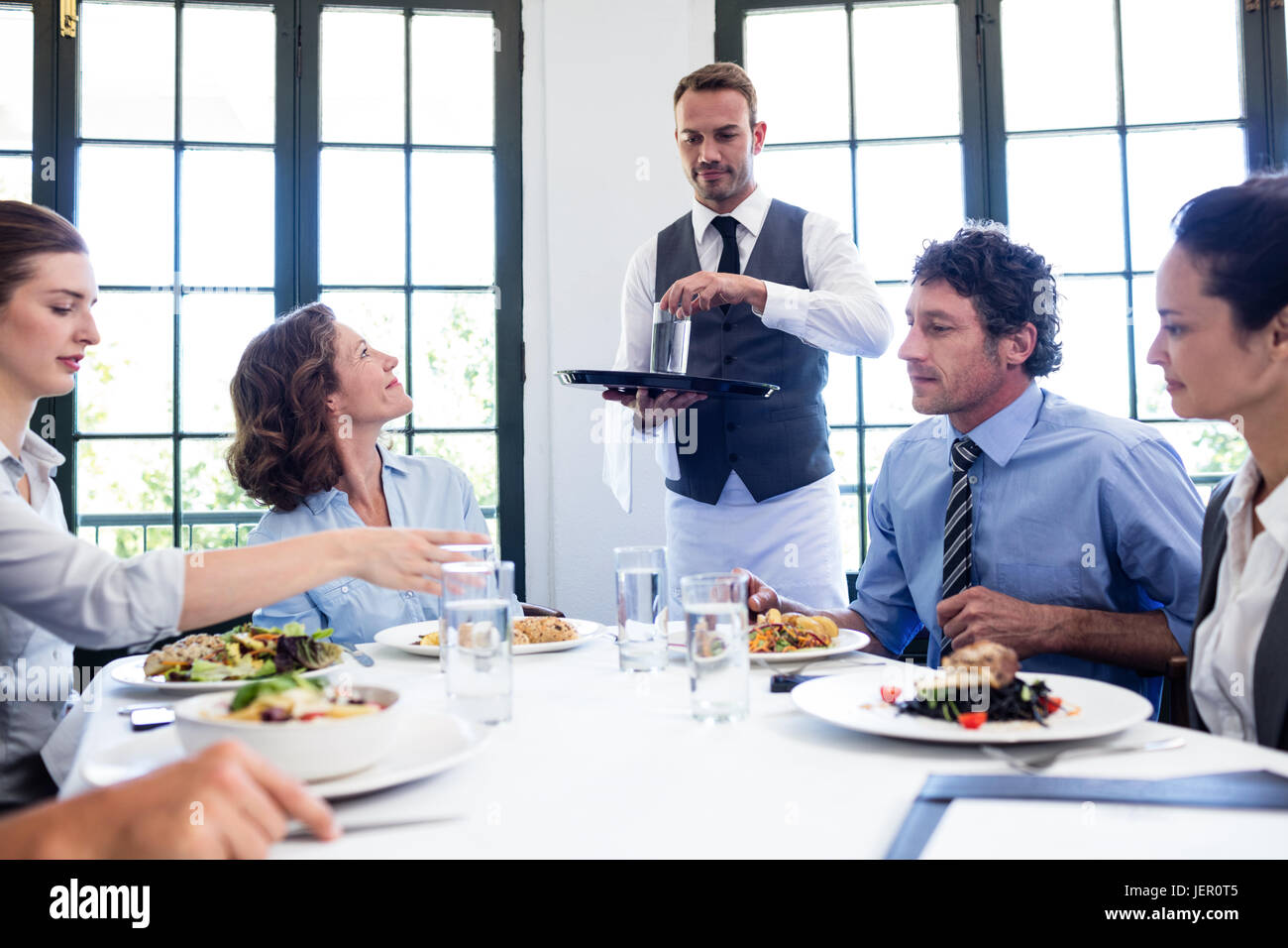 Waiter serving water hi-res stock photography and images - Alamy