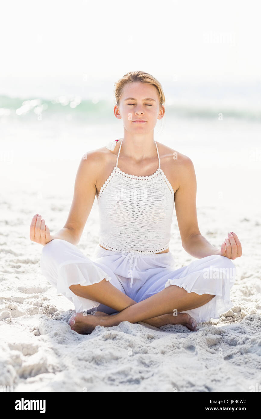 Beautiful woman in lotus position Stock Photo - Alamy