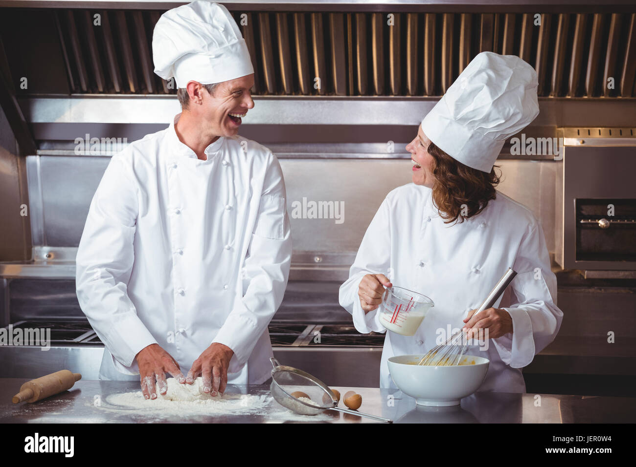 Focused chef preparing a cake Stock Photo - Alamy