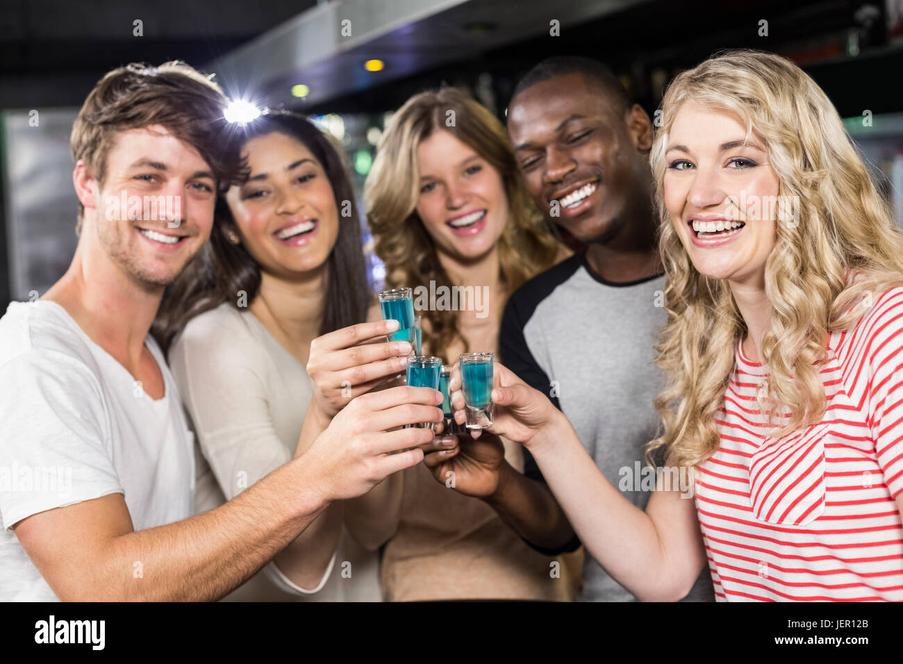 Friends toasting with shots Stock Photo - Alamy