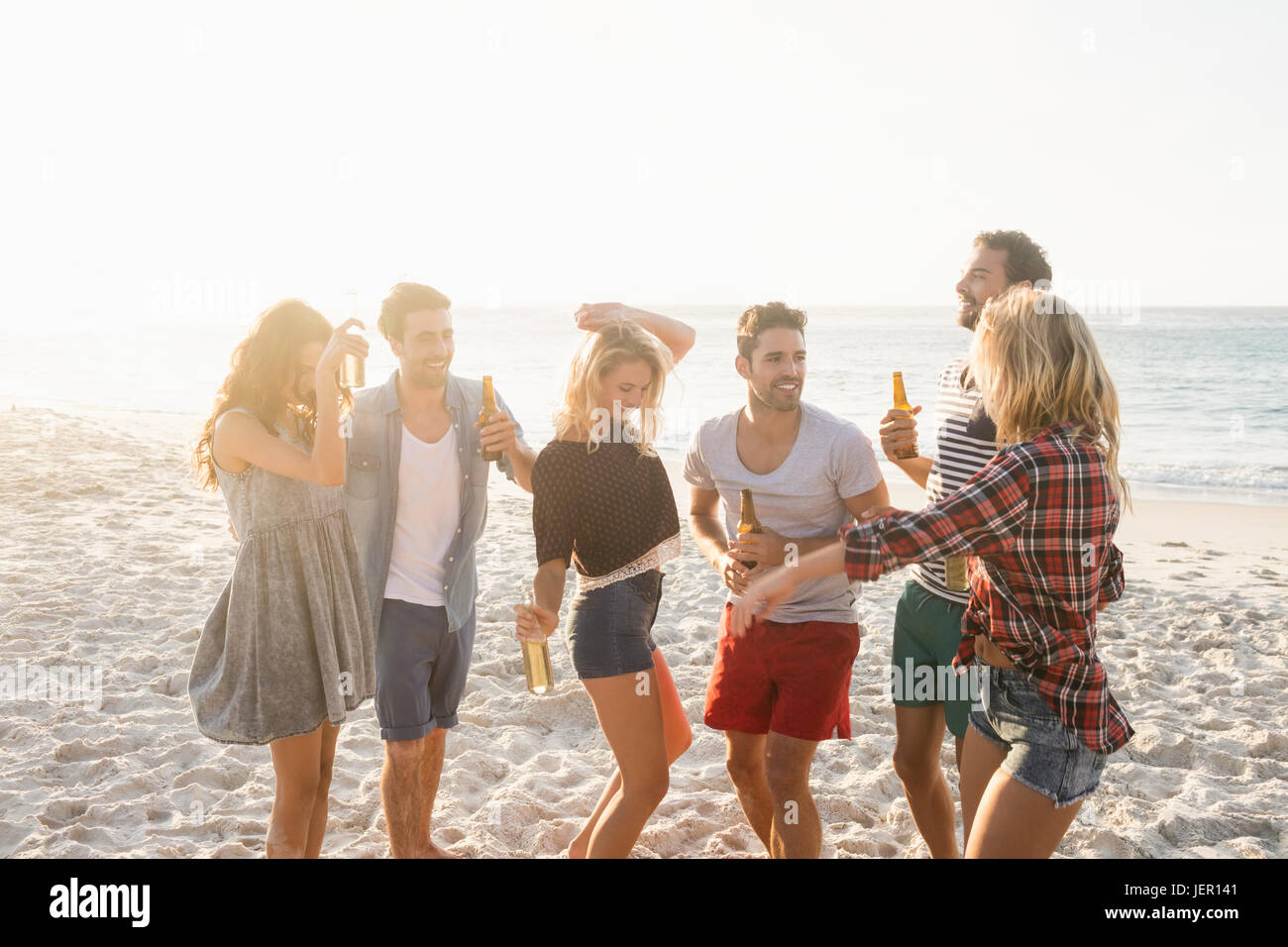 Happy friends dancing together Stock Photo - Alamy