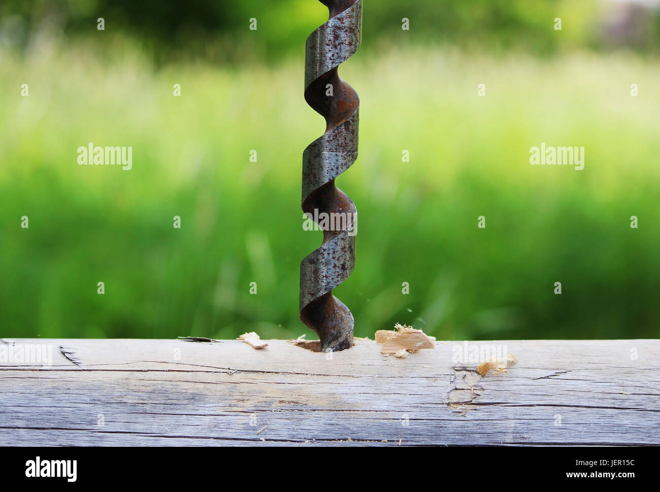 Metal spiral drill for making holes in logs when assembling a wooden ...