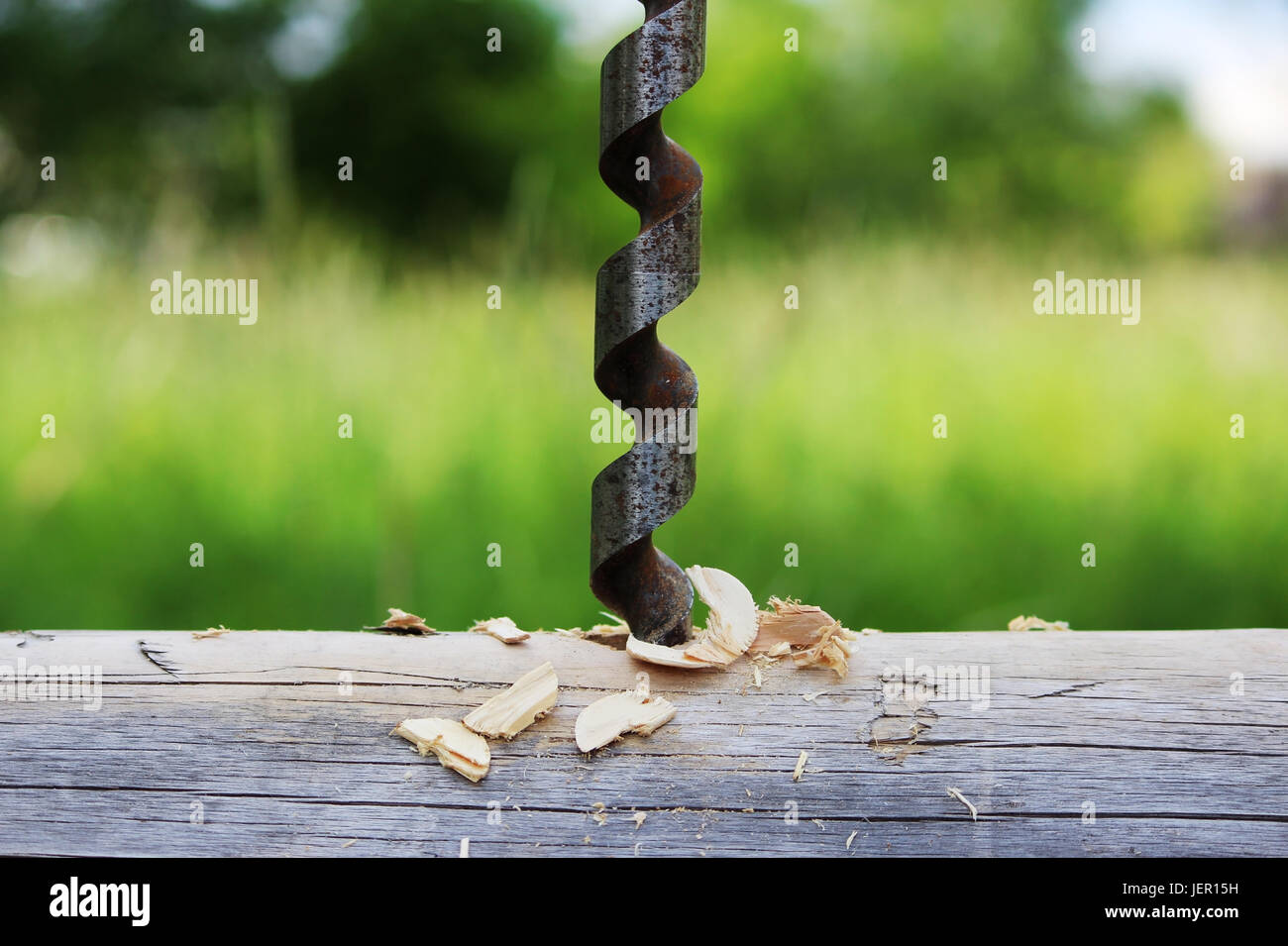 Metal spiral drill for making holes in logs when assembling a wooden ...