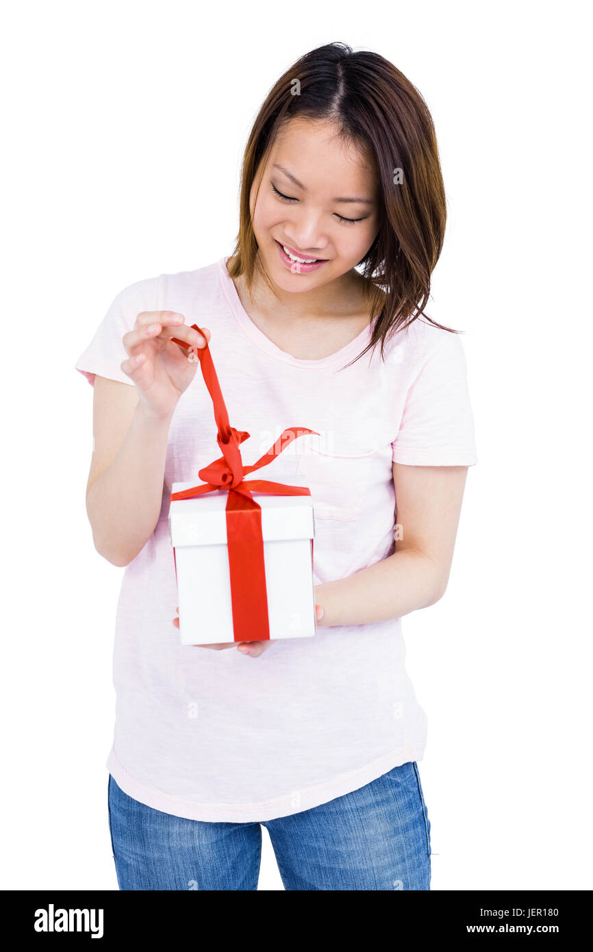 Young woman opening a present Stock Photo - Alamy