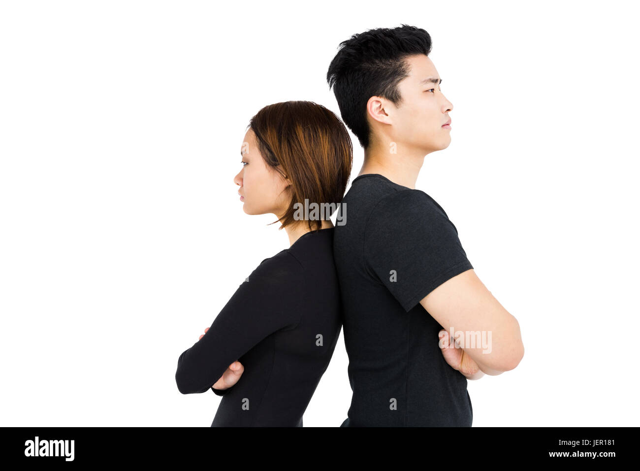 Depressed couple standing back to back Stock Photo - Alamy