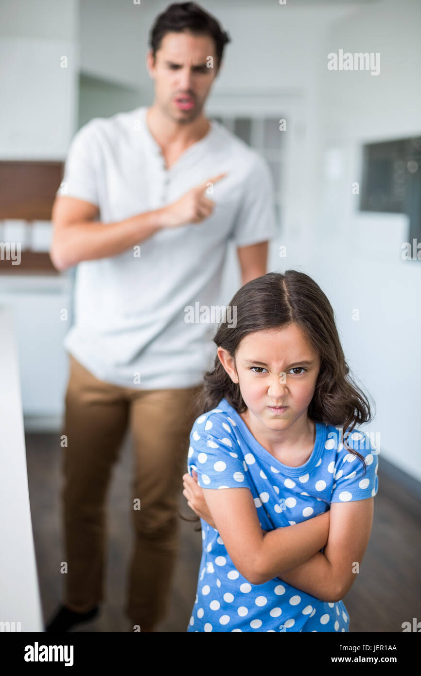 Portrait of angry daughter with arms crossed Stock Photo - Alamy