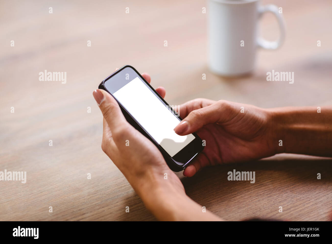Cropped hand using mobile phone Stock Photo - Alamy