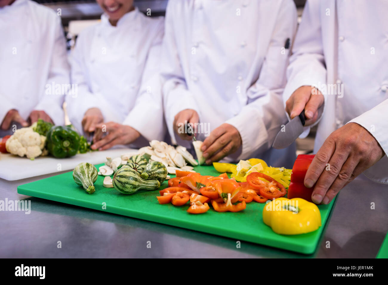 Chefs slicing vegetables hi-res stock photography and images - Alamy