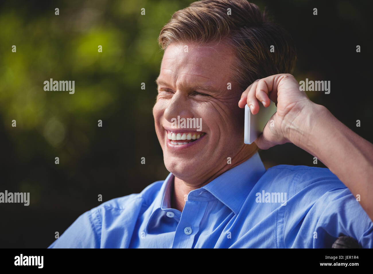 Handsome businessman having a phone call Stock Photo - Alamy