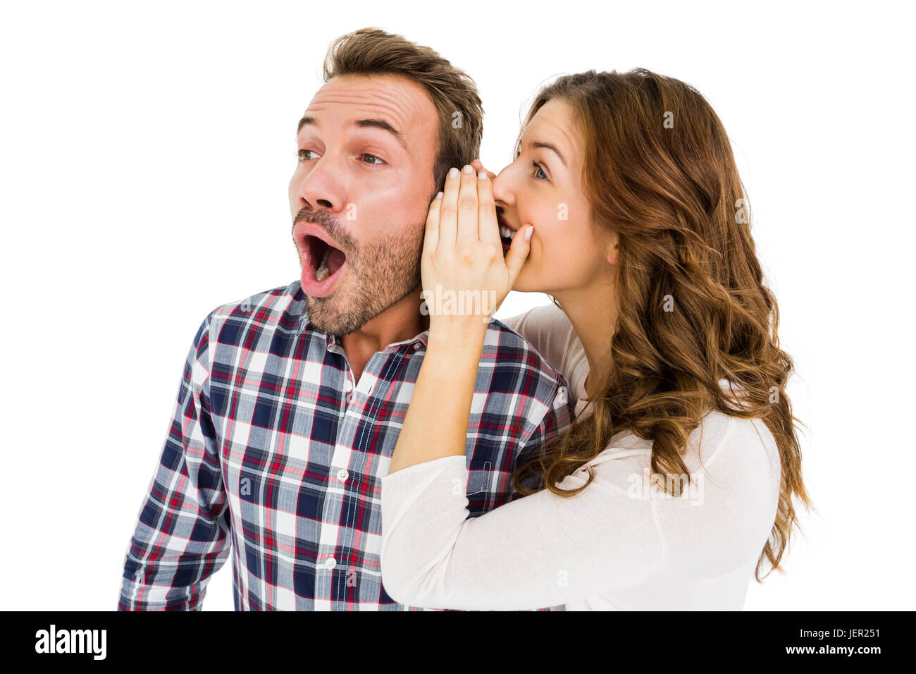 Woman whispering into mans ears Stock Photo - Alamy
