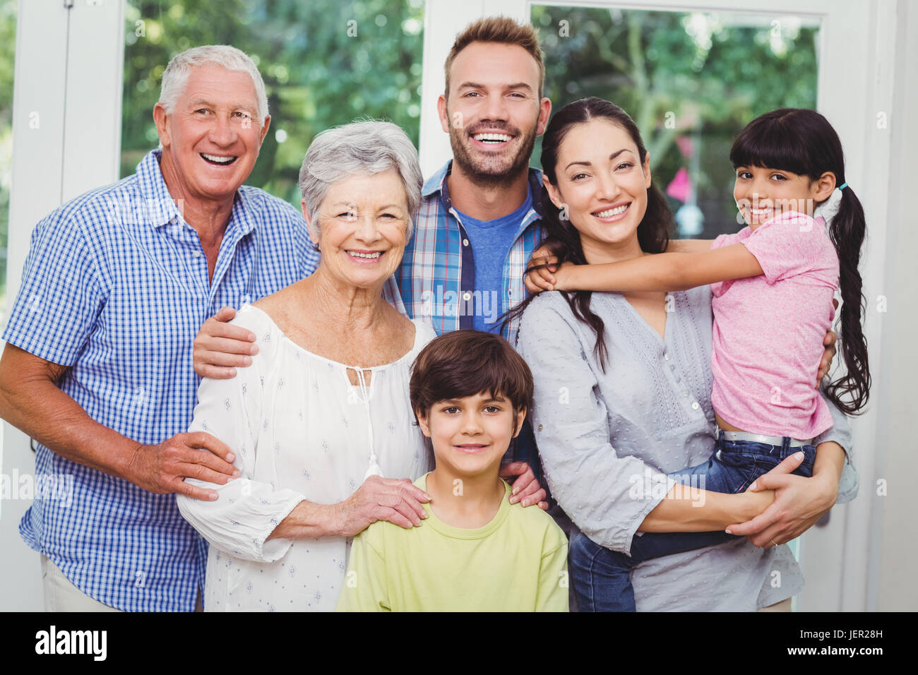 Portrait of cheerful multi generation family Stock Photo - Alamy