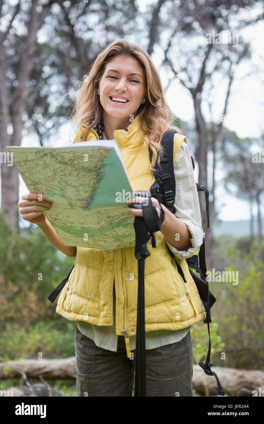 Woman checking the map Stock Photo - Alamy