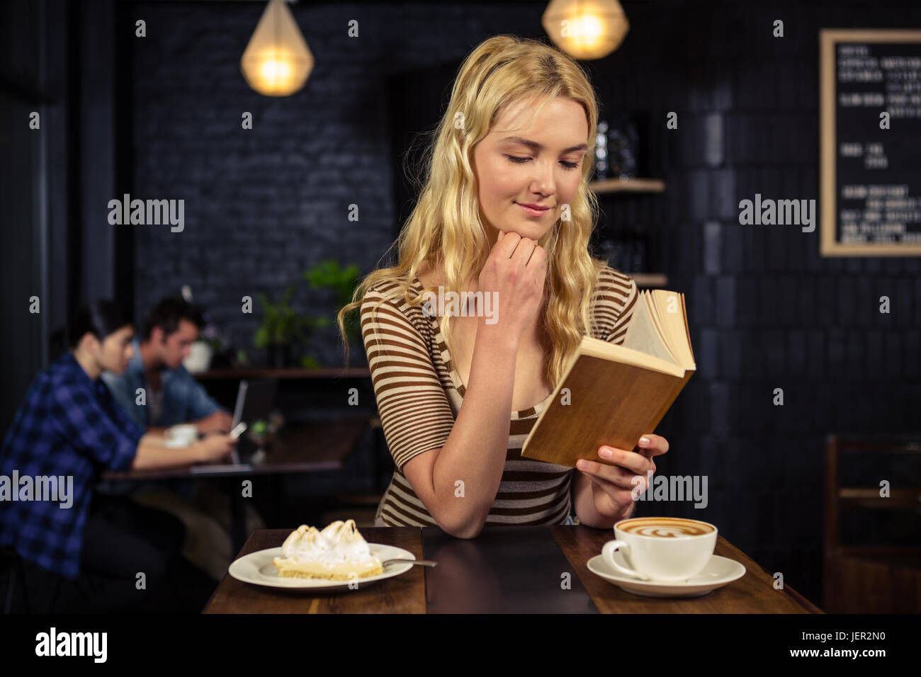Woman reading a book Stock Photo - Alamy