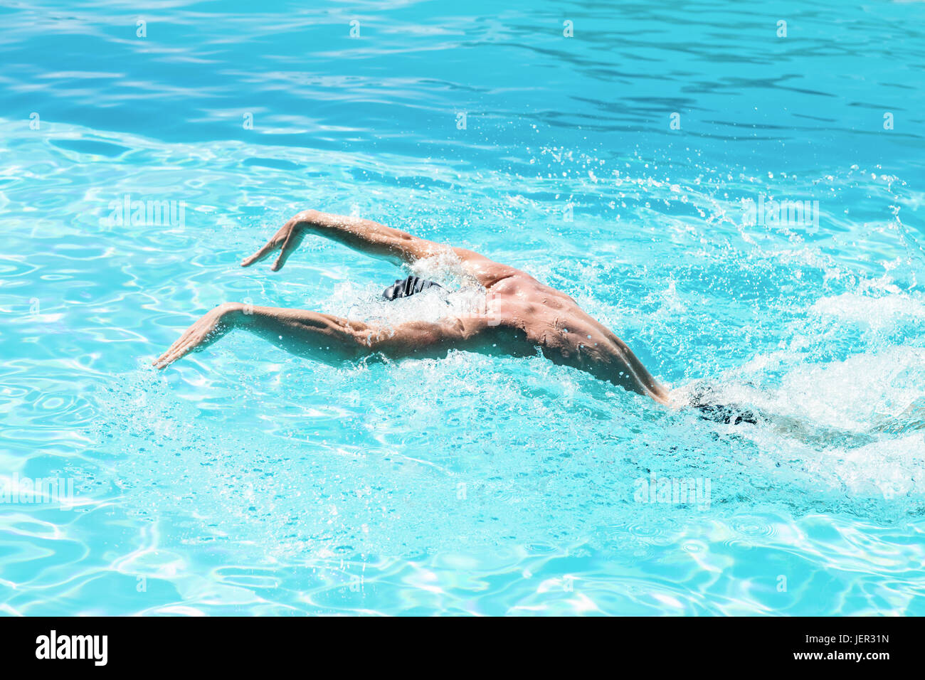 Fit swimmer doing the butterfly stroke Stock Photo - Alamy