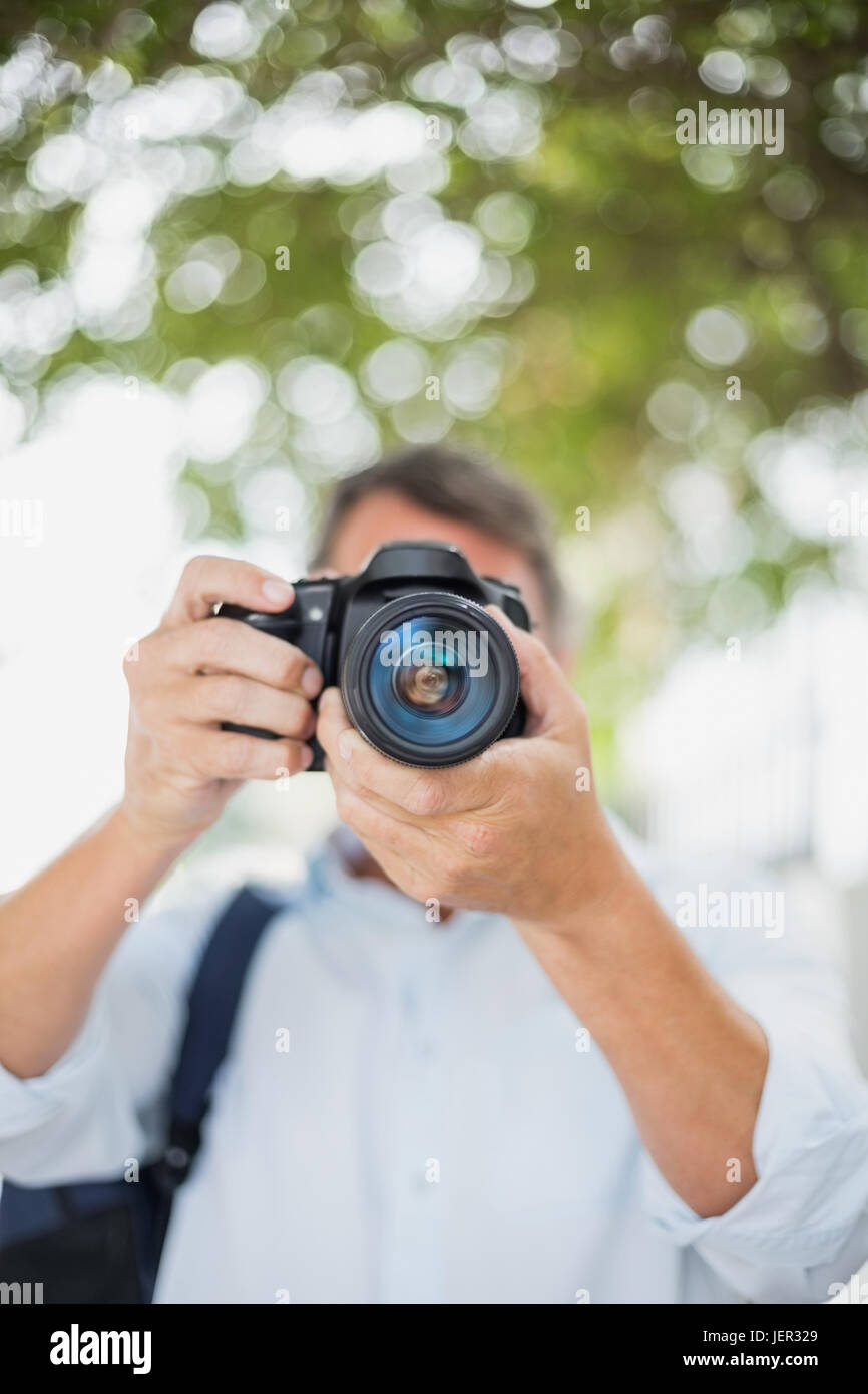 Close-up of man using camera Stock Photo - Alamy