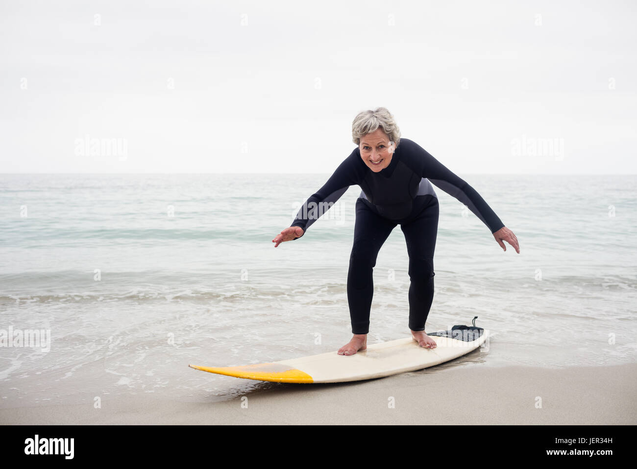 Senior surfing on sea hi-res stock photography and images - Alamy