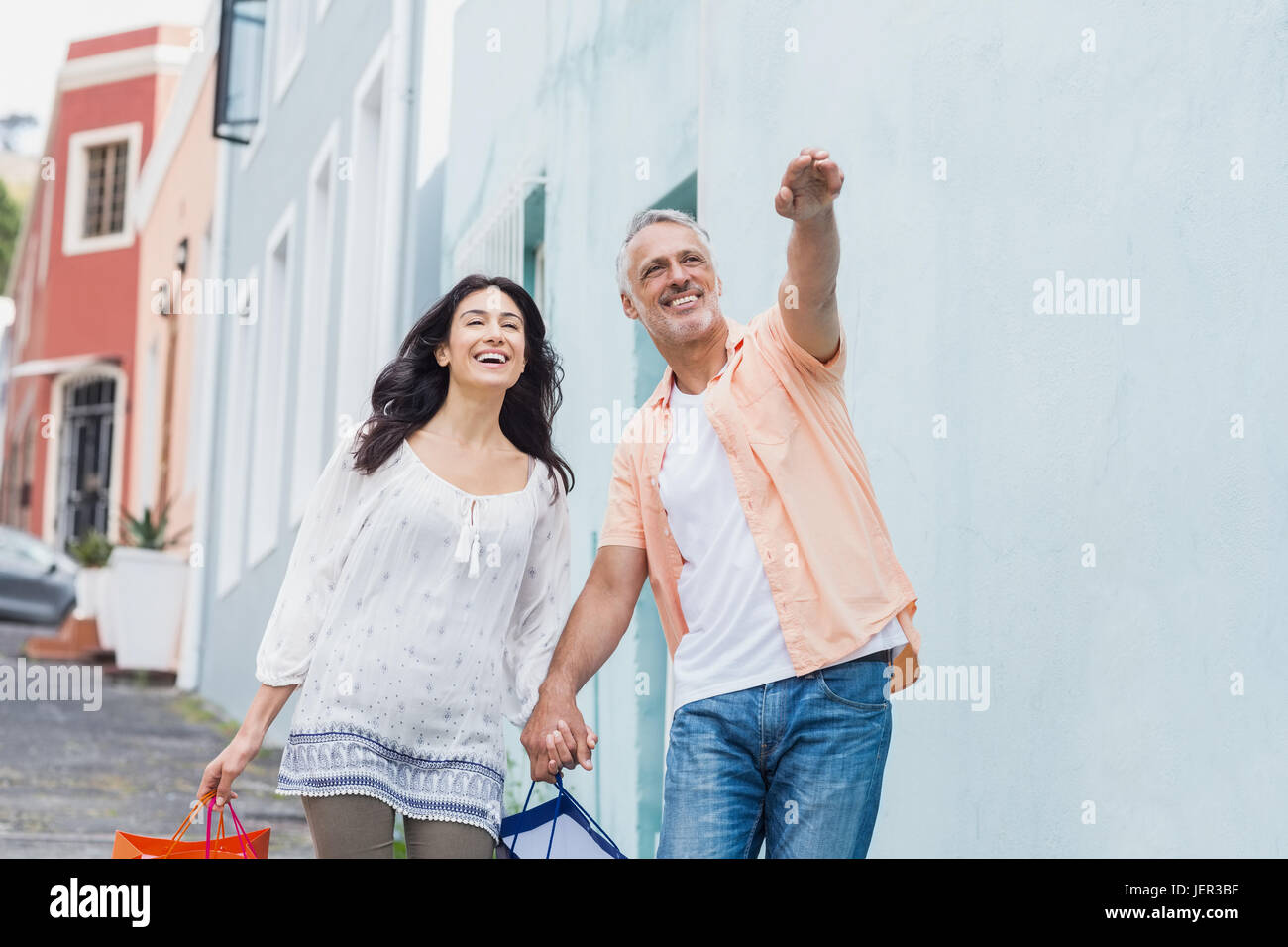 Man woman pointing building hi-res stock photography and images - Alamy