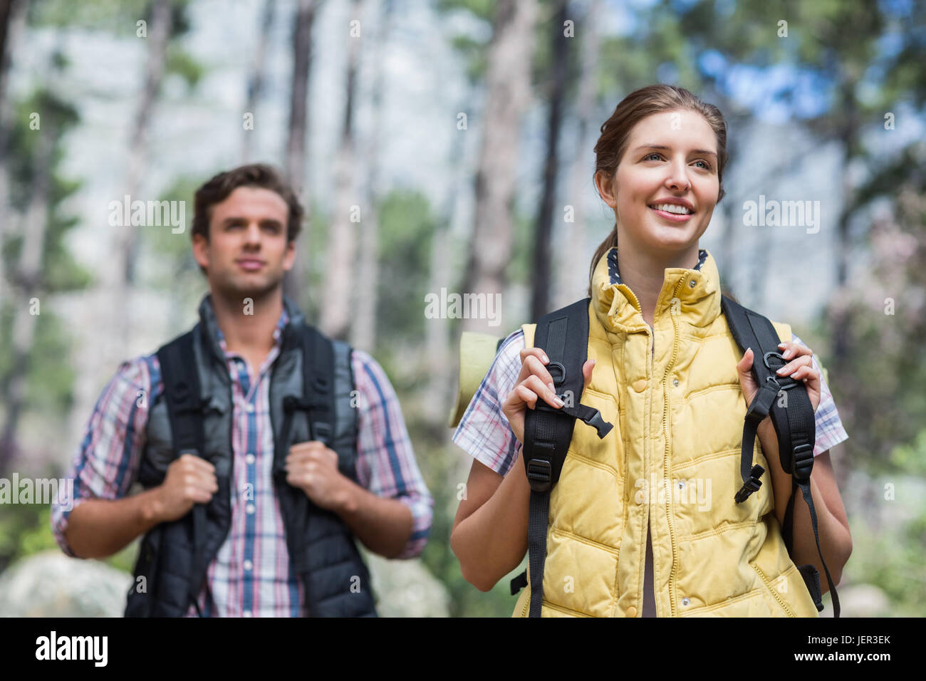 Low angle view of couple hiking Stock Photo - Alamy
