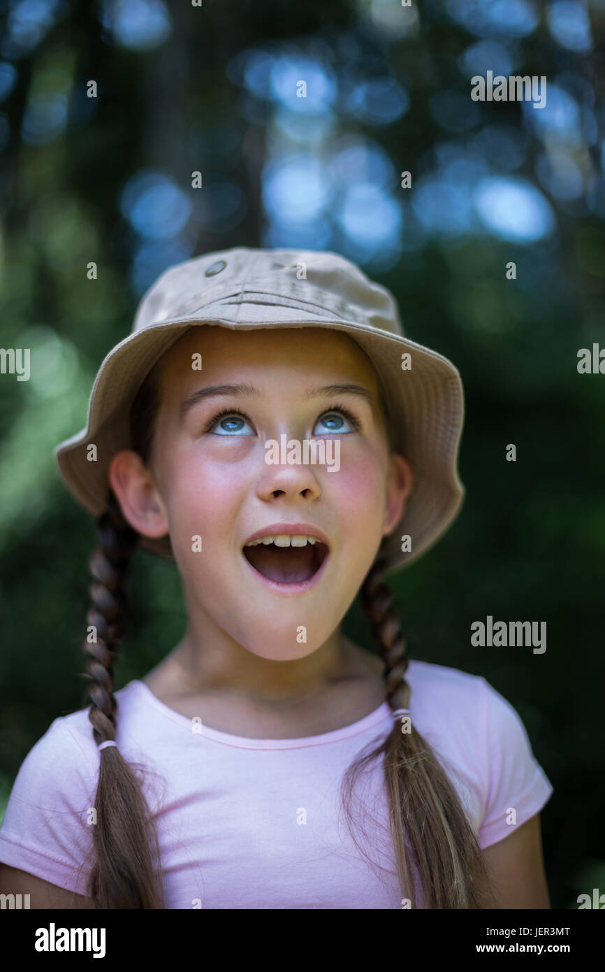 Surprised girl looking up Stock Photo - Alamy