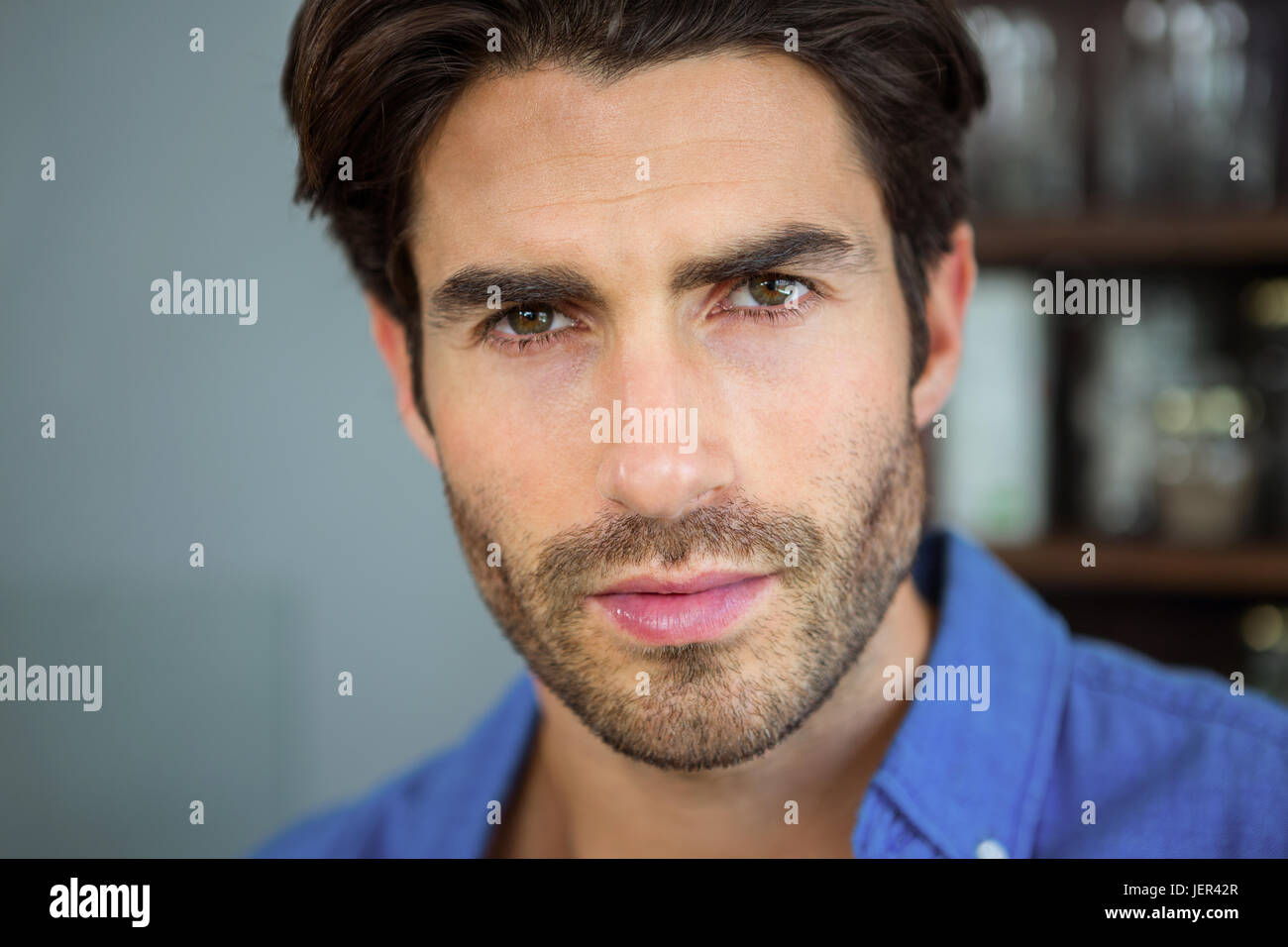 Portrait of confident young man Stock Photo - Alamy
