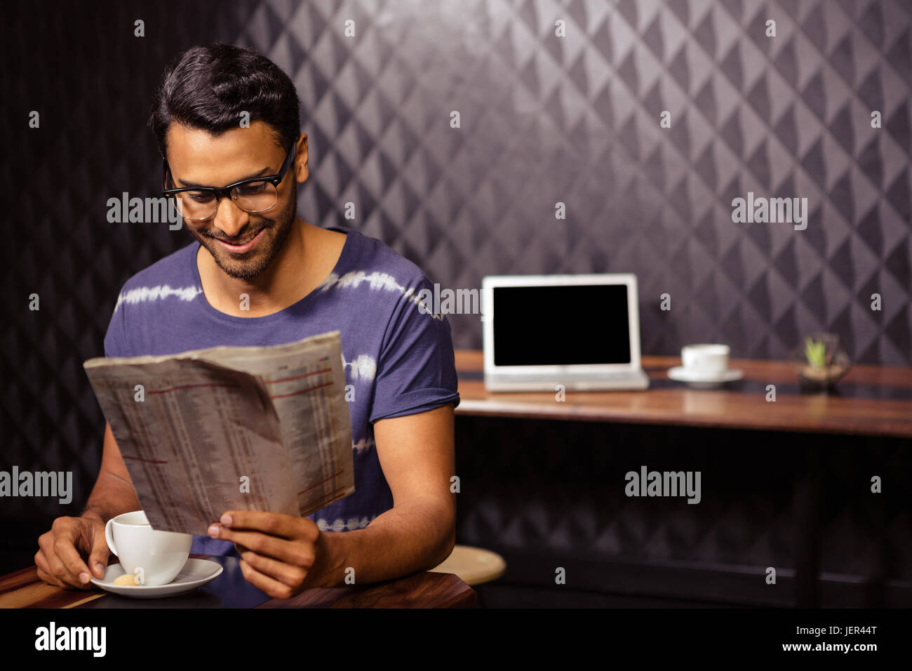 Man reading the newspaper Stock Photo - Alamy