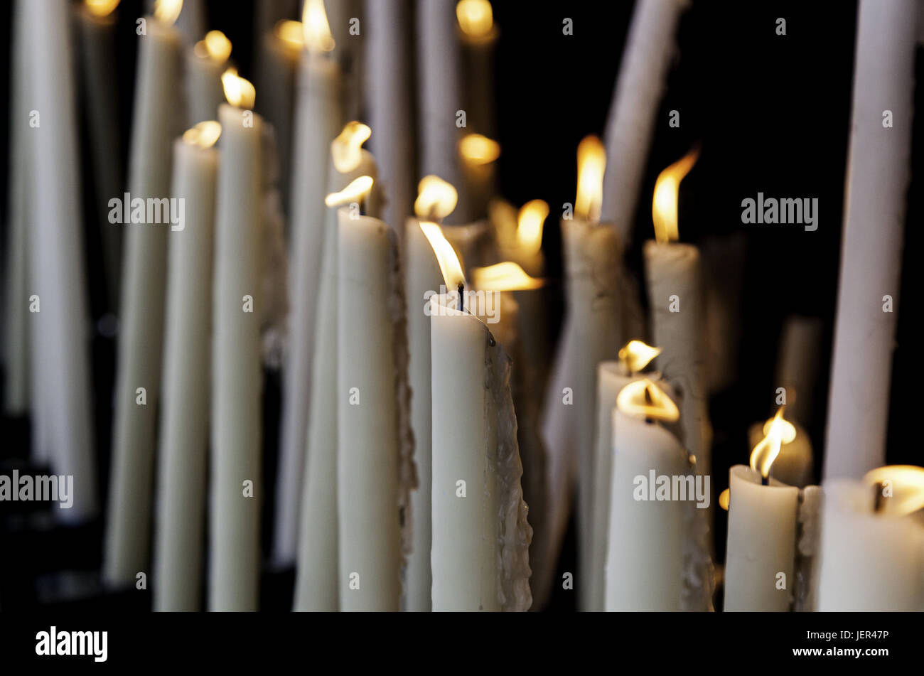 Wax candles burning in a Christian tradition, flame and faith Stock ...