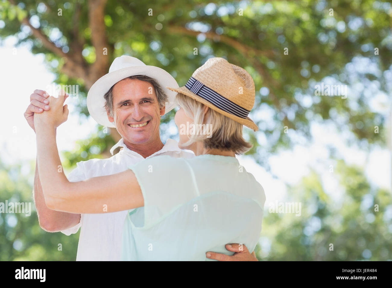 Happy couple dancing outdoors Stock Photo - Alamy