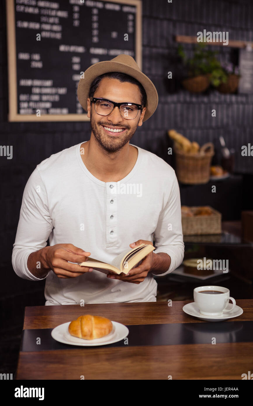 Man reading a book Stock Photo - Alamy