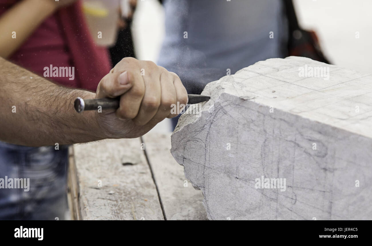 Carving stone, craftsman shaping stone, art and crafts Stock Photo - Alamy