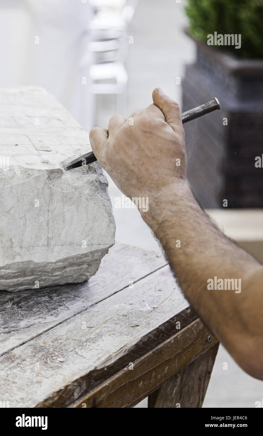 Carving stone, craftsman shaping stone, art and crafts Stock Photo - Alamy
