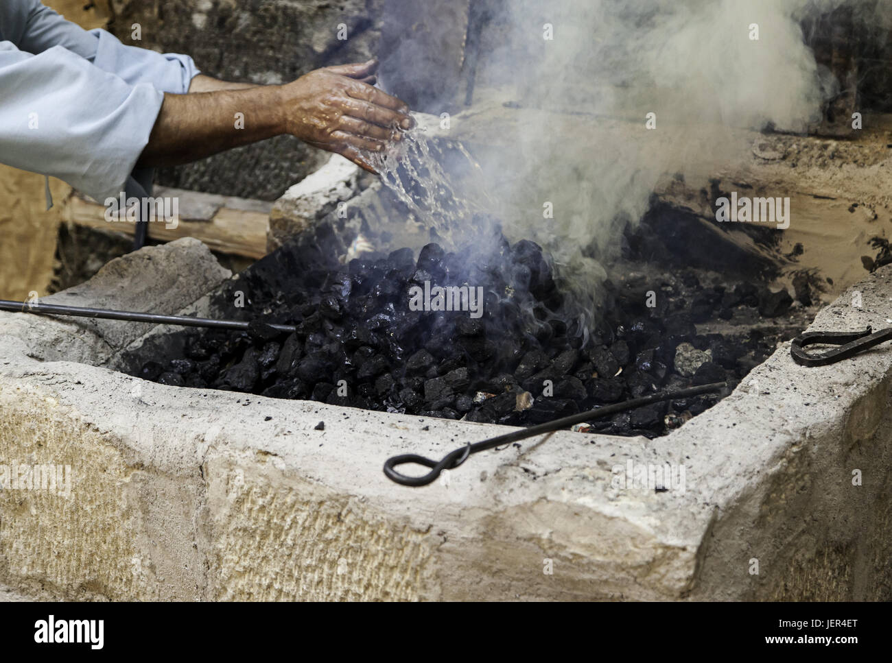 Extinguishing flames with water in the carbon, safety detail Stock ...