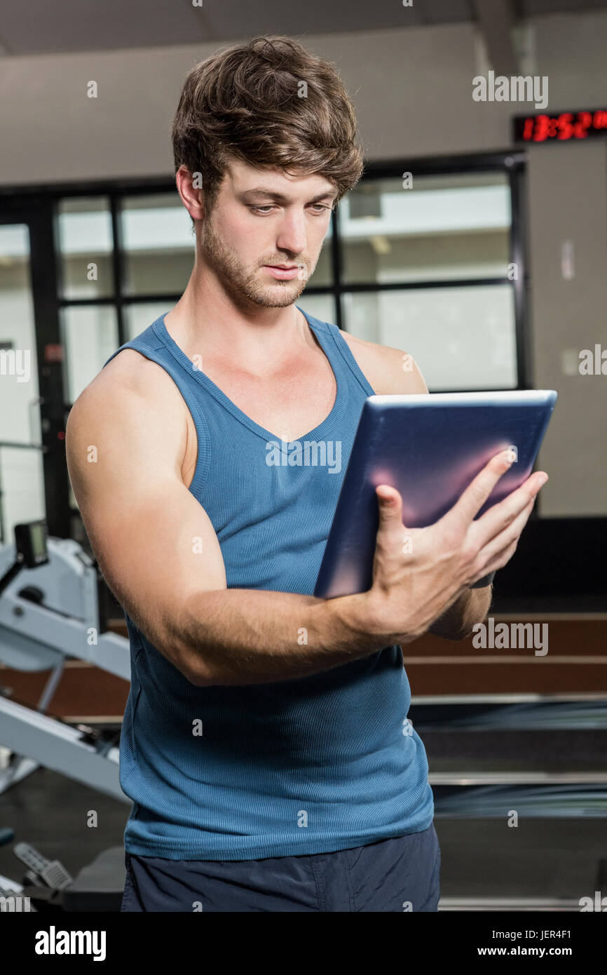 Gym trainer using a digital tablet Stock Photo - Alamy