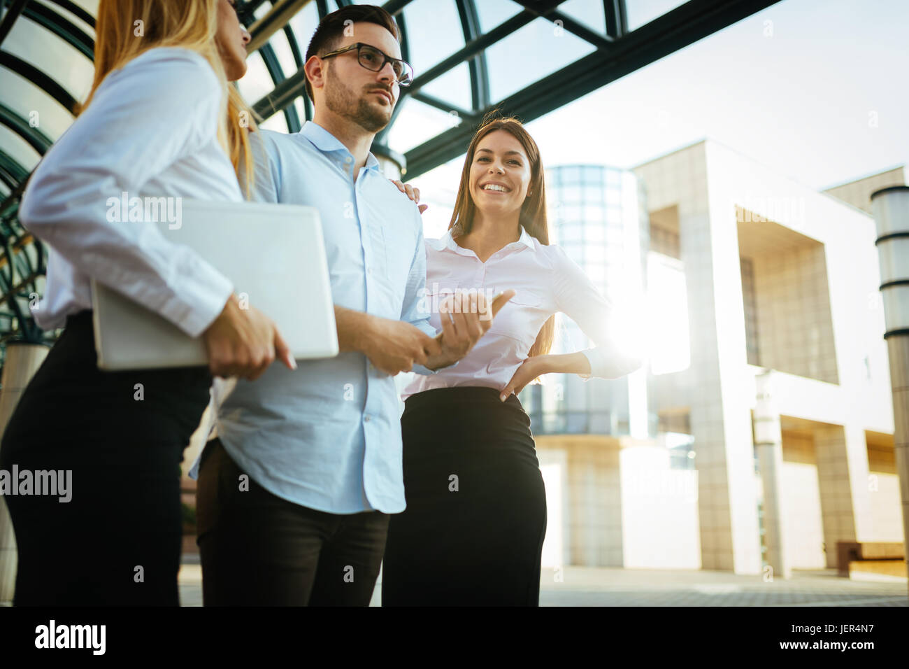 Picture of young attractive business partners standing outdoor Stock ...